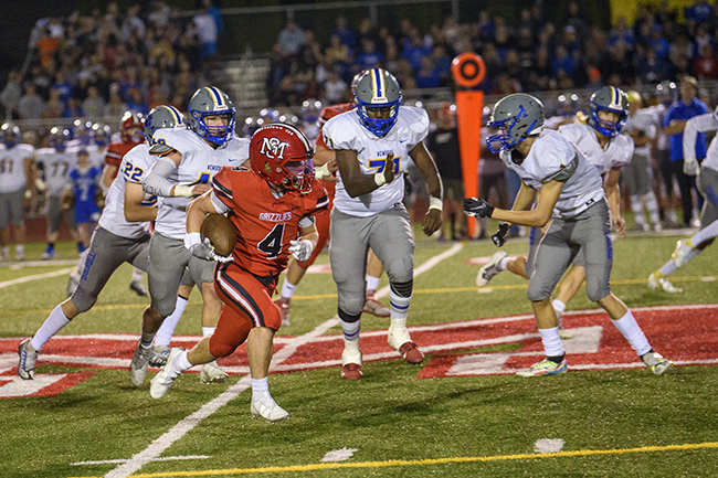 Mac routs rival Newberg, 49-21, for pivotal win in league opener